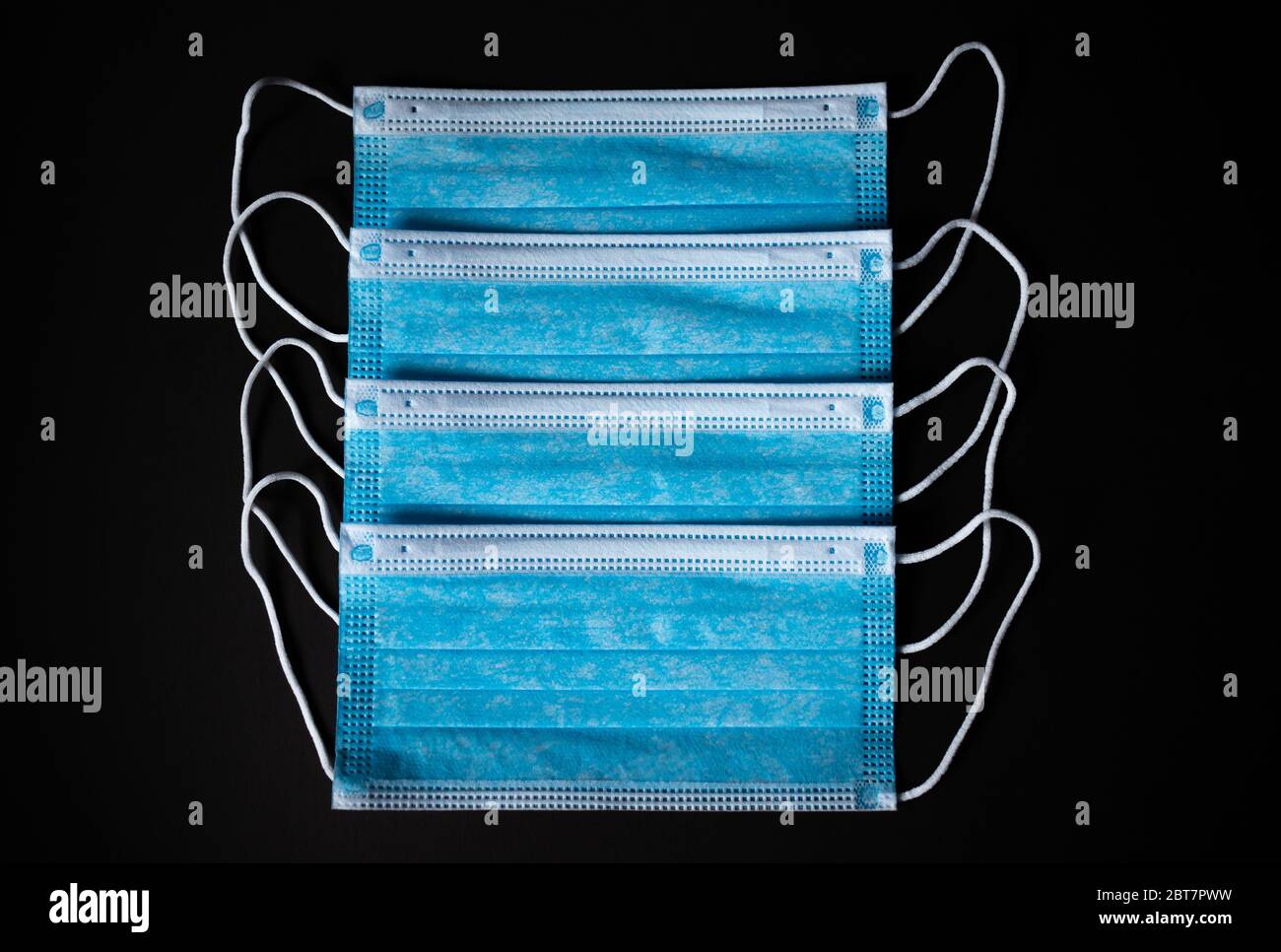 Four black medical masks hi-res stock photography and images - Alamy