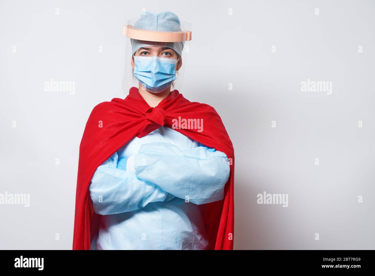 Doctor wearing surgical face mask in superhero cape. Concept of super ...