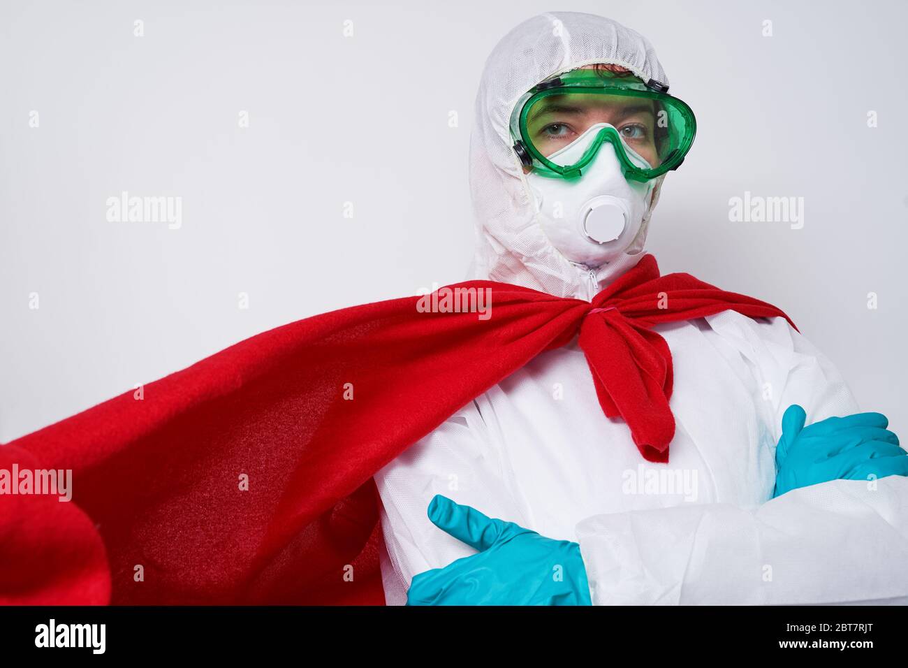 Doctor is wearing PPE - costume, gloves and surgical face mask in ...