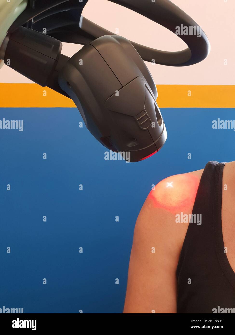 Laser therapy. Physical therapy using a laser to treat an injured ...