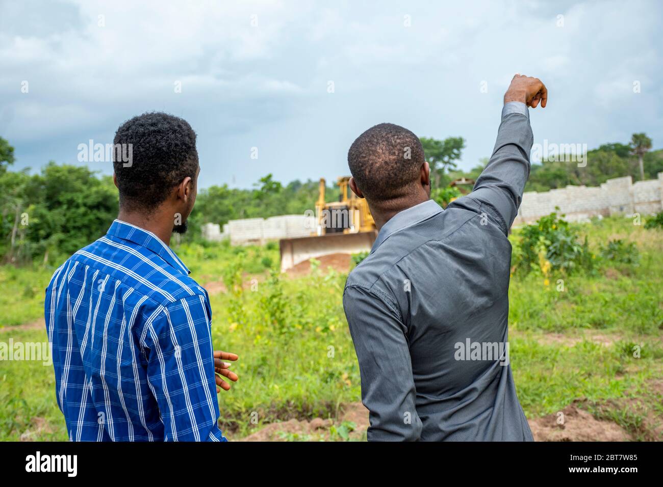 two african men, surveying a piece of land Stock Photo - Alamy