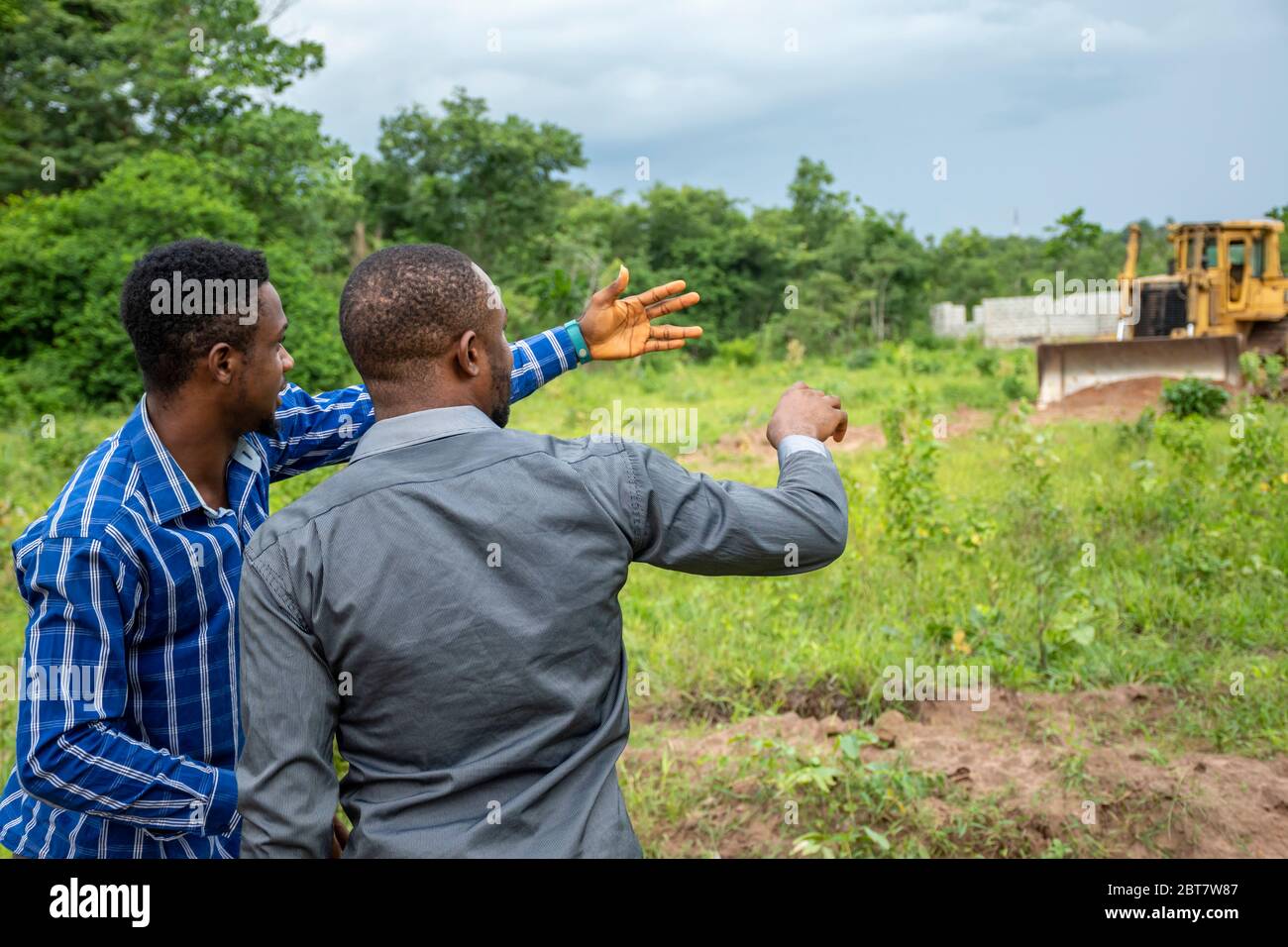 two young african business men, survey a piece of land Stock Photo - Alamy