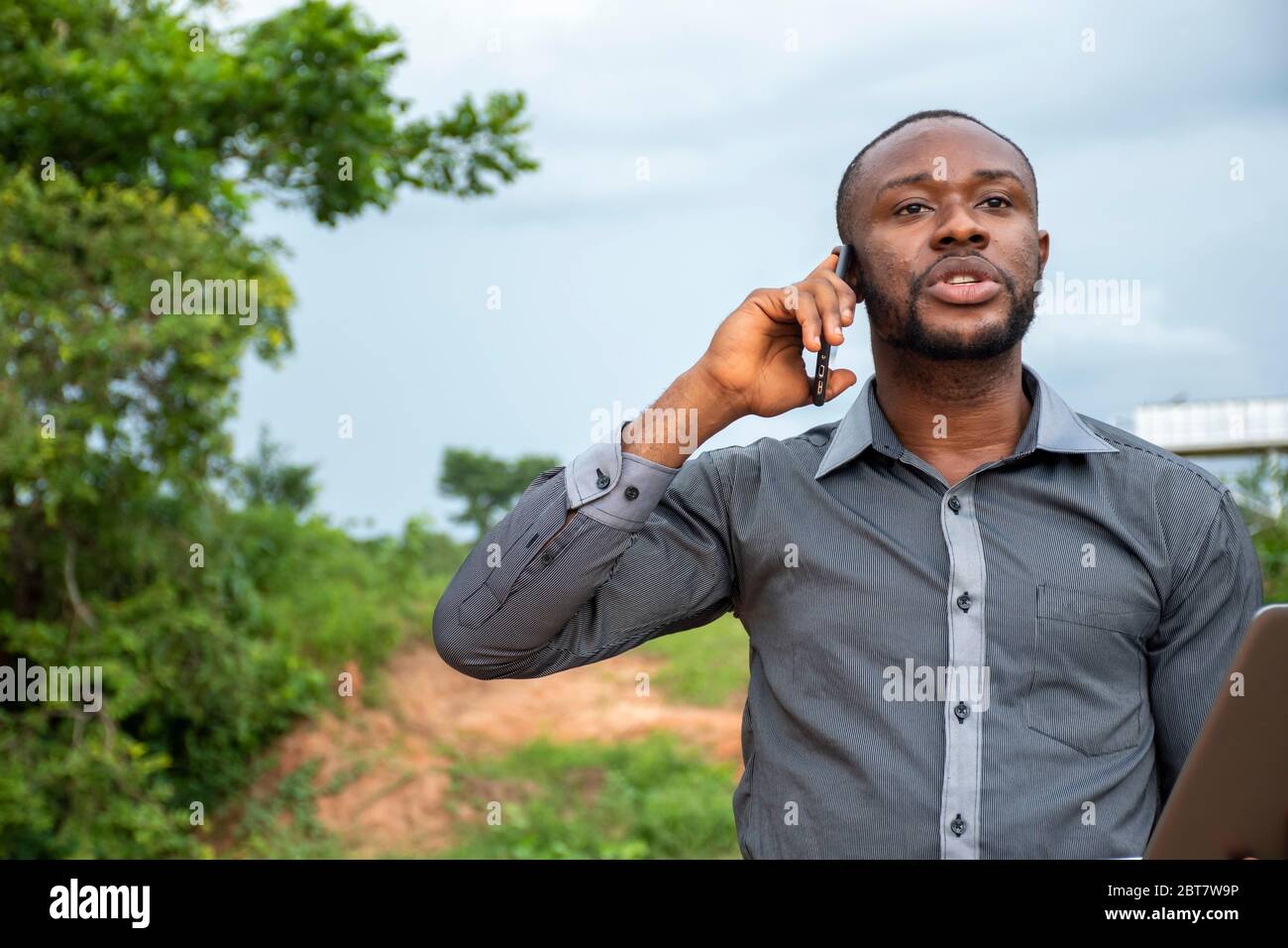 young african business man making a phone call, looking worried Stock ...
