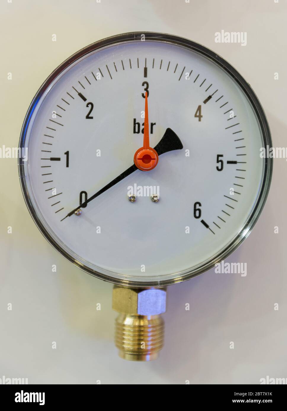 Pressure measuring industrial instrument closeup on a white background ...