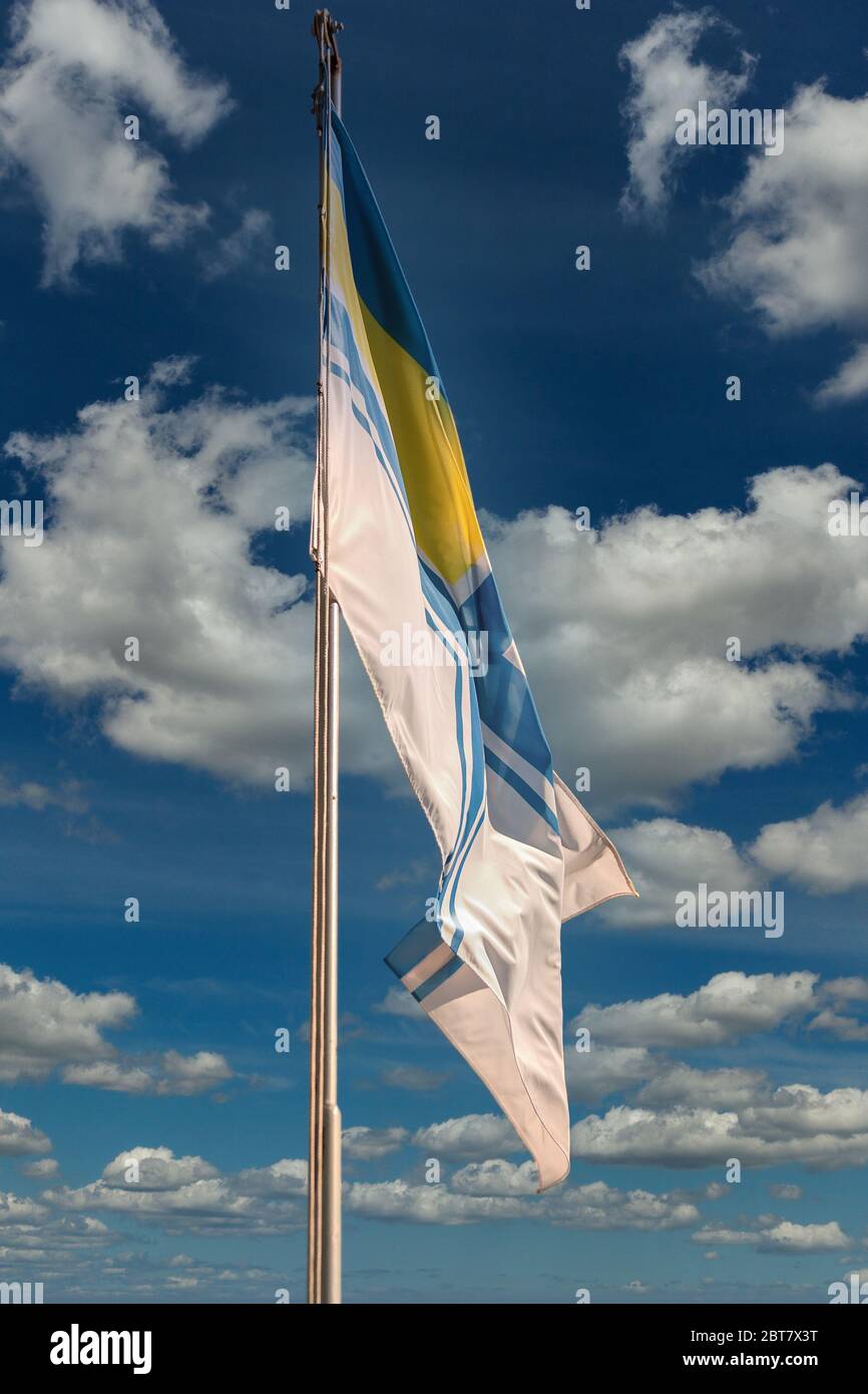 Naval flag of Ukraine closeup outdoor against blue sky with clouds ...