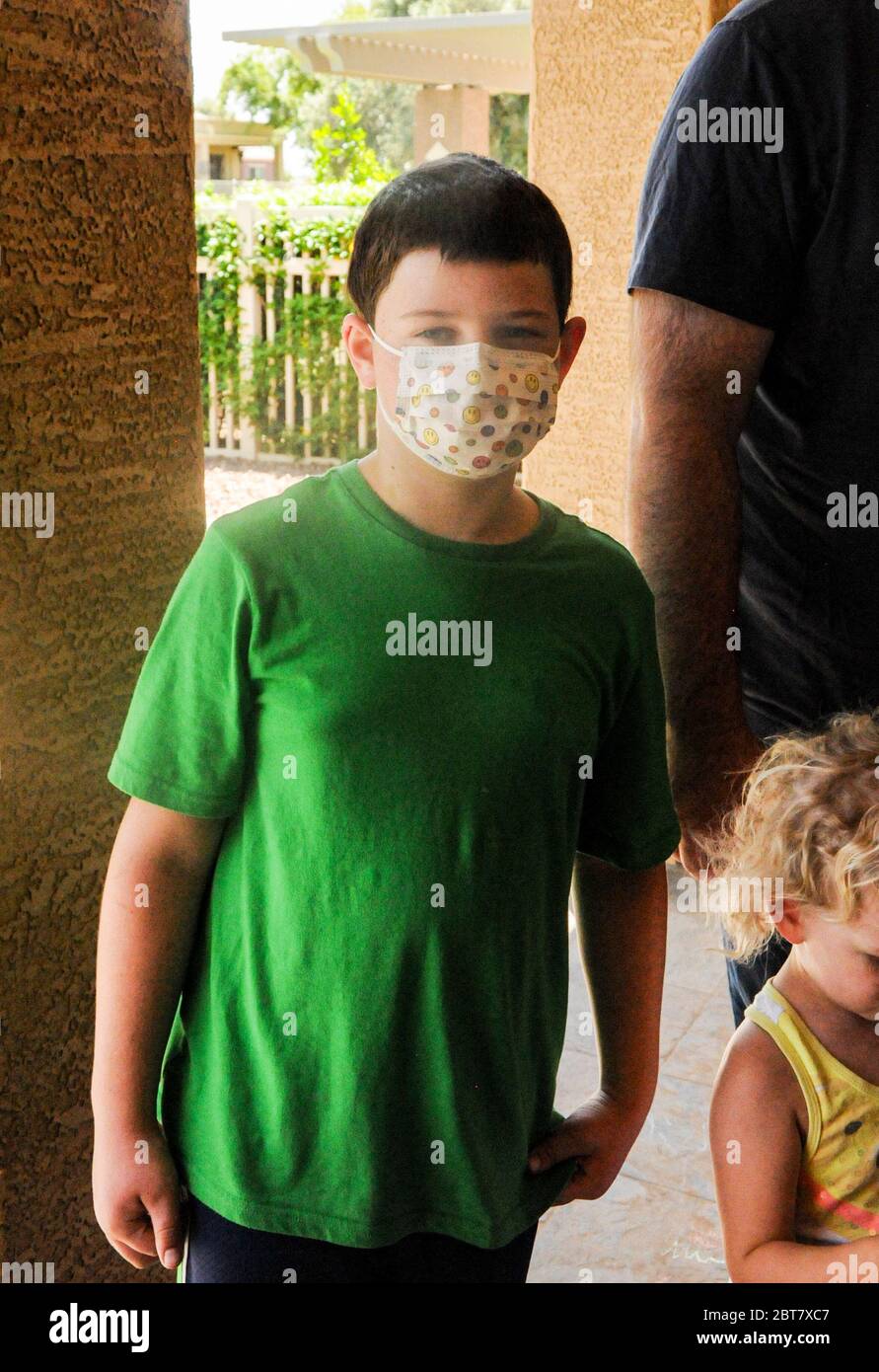 Young boy wears a child’s face mask during the pandemic Stock Photo - Alamy