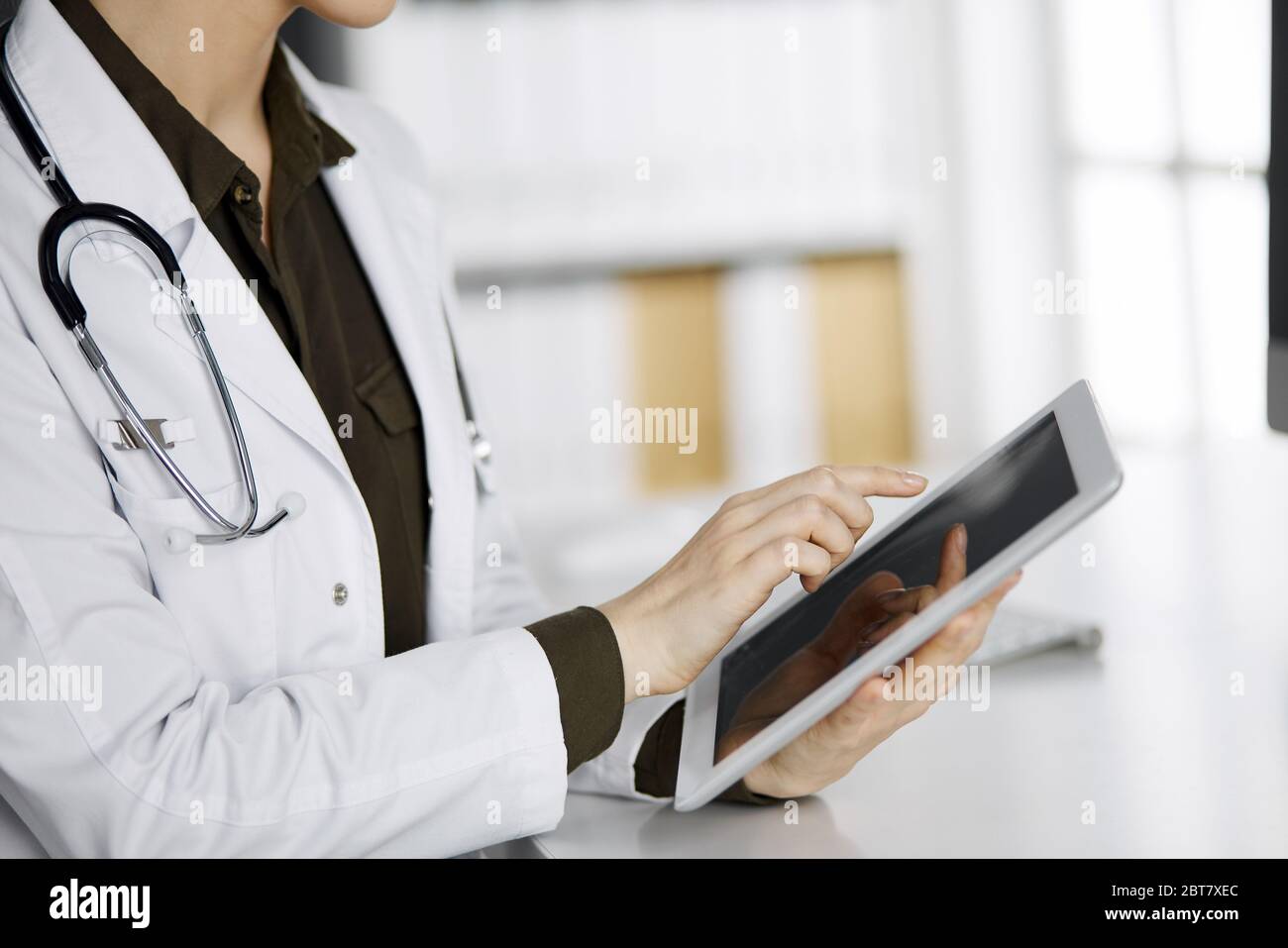 Unknown Female Doctor Using Tablet Computer In Clinic Perfect Medical