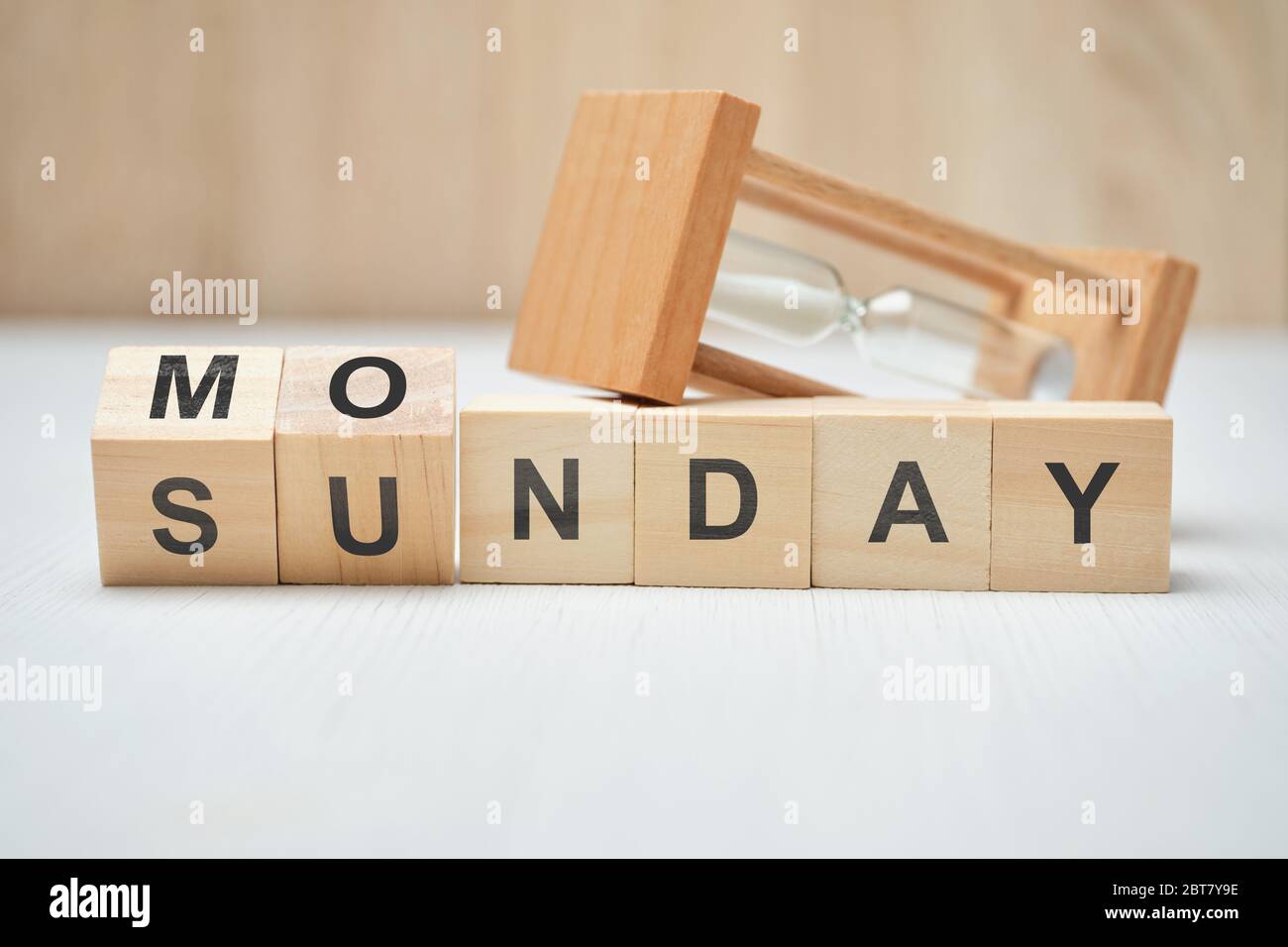 Mon and sunday change on wooden blocks. Close up Stock Photo - Alamy