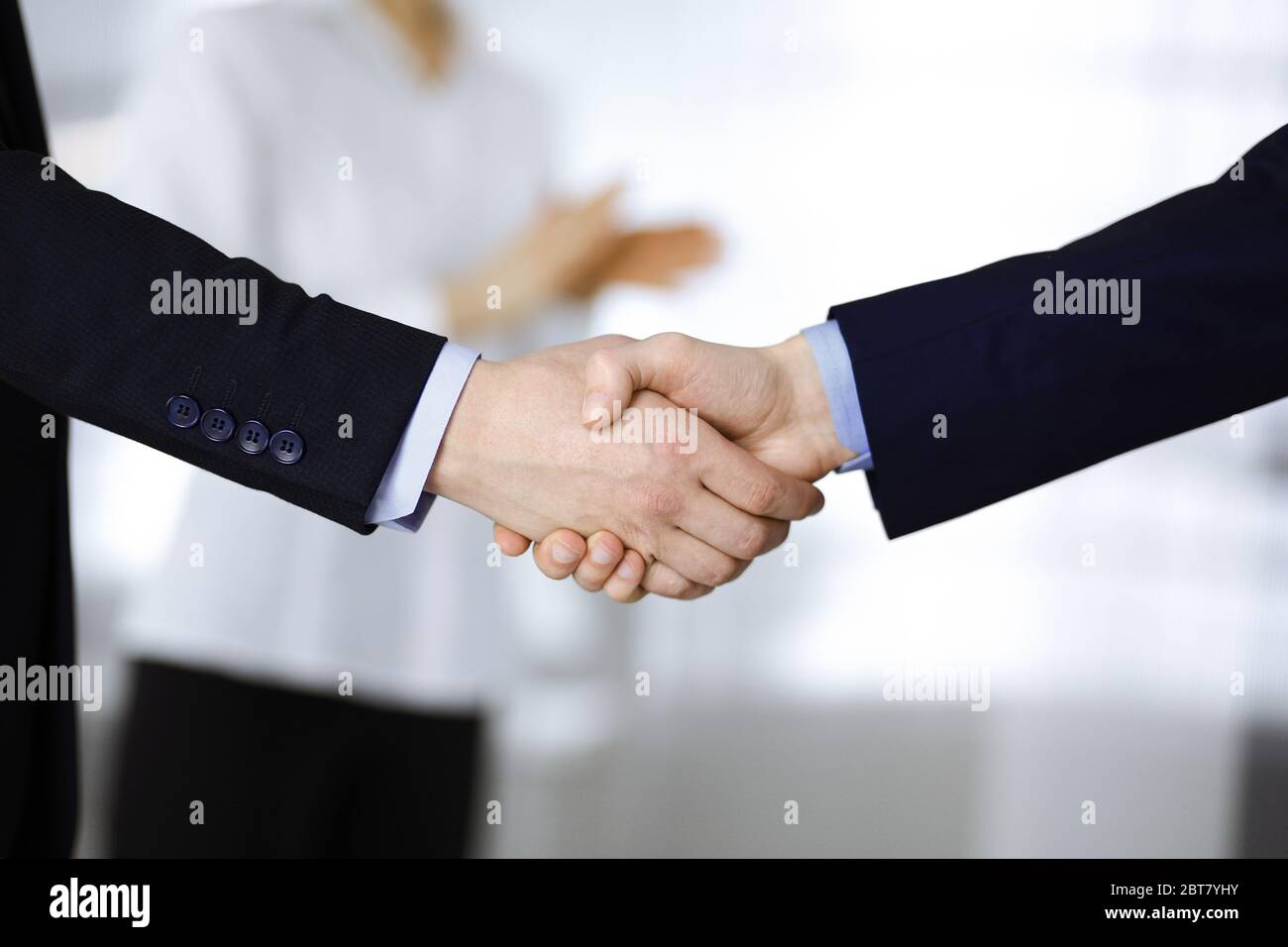 Business people shaking hands at meeting or negotiation, close-up ...