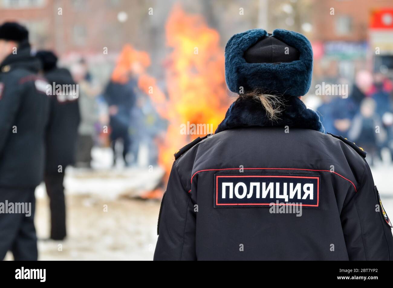 Police officer is on guard. Text is on back in Russian: police Stock ...