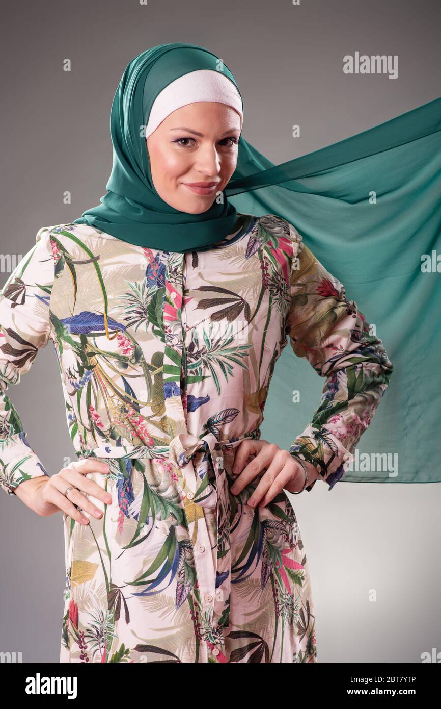 Beautiful muslim woman with hijab posing on the gray background Stock ...