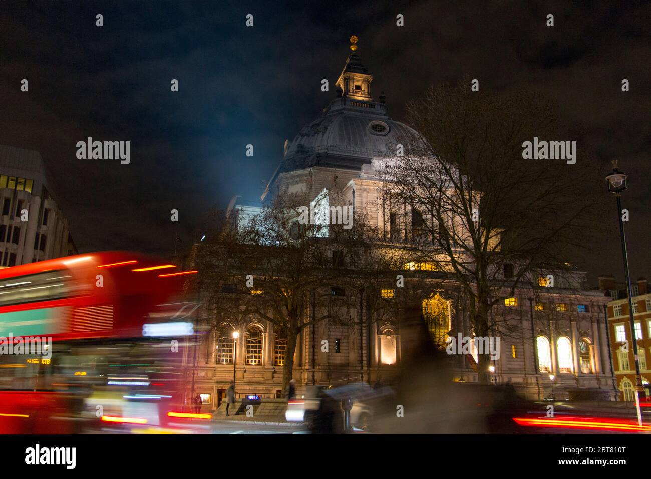 view of dome of Methodist Church by night with double decker bus ...