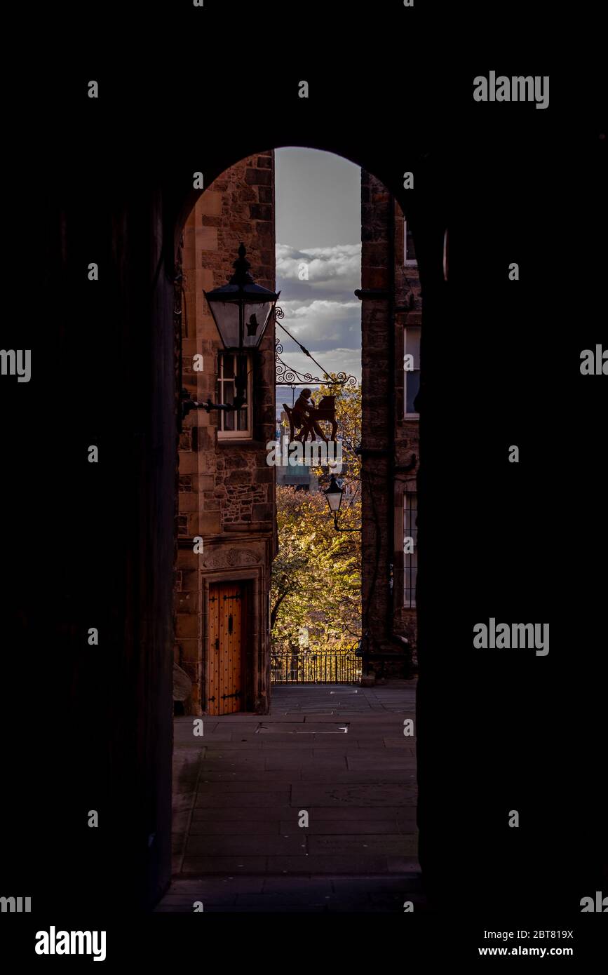 Sign for the Writers Museum Edinburgh through archway with old lantern ...