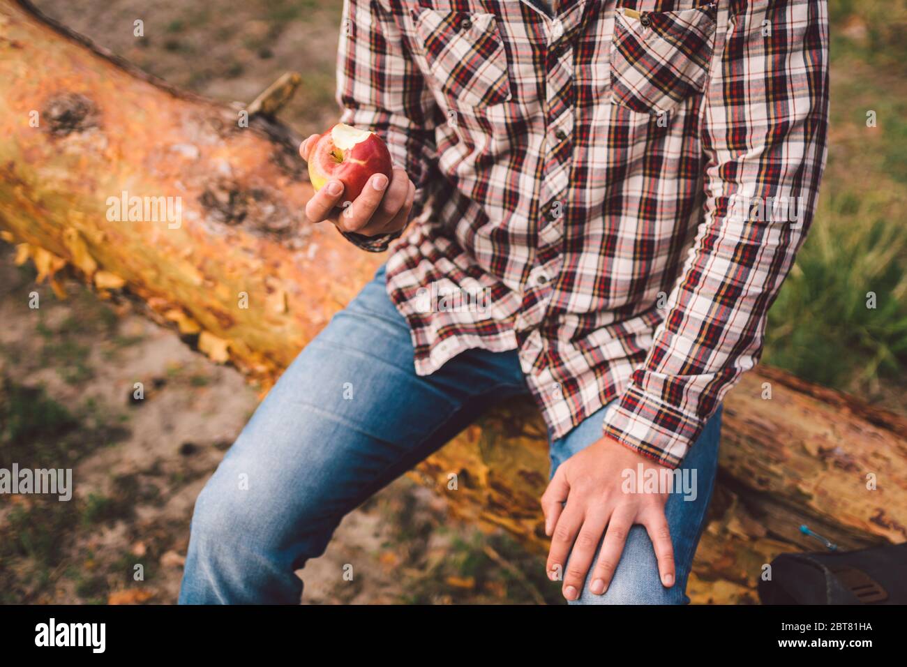Hiker sitting lake eating apple hi-res stock photography and images - Alamy