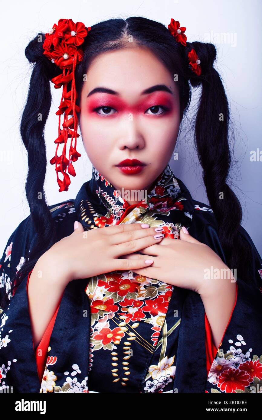 young pretty geisha in black kimono with sakura, asian ethno closeup on ...