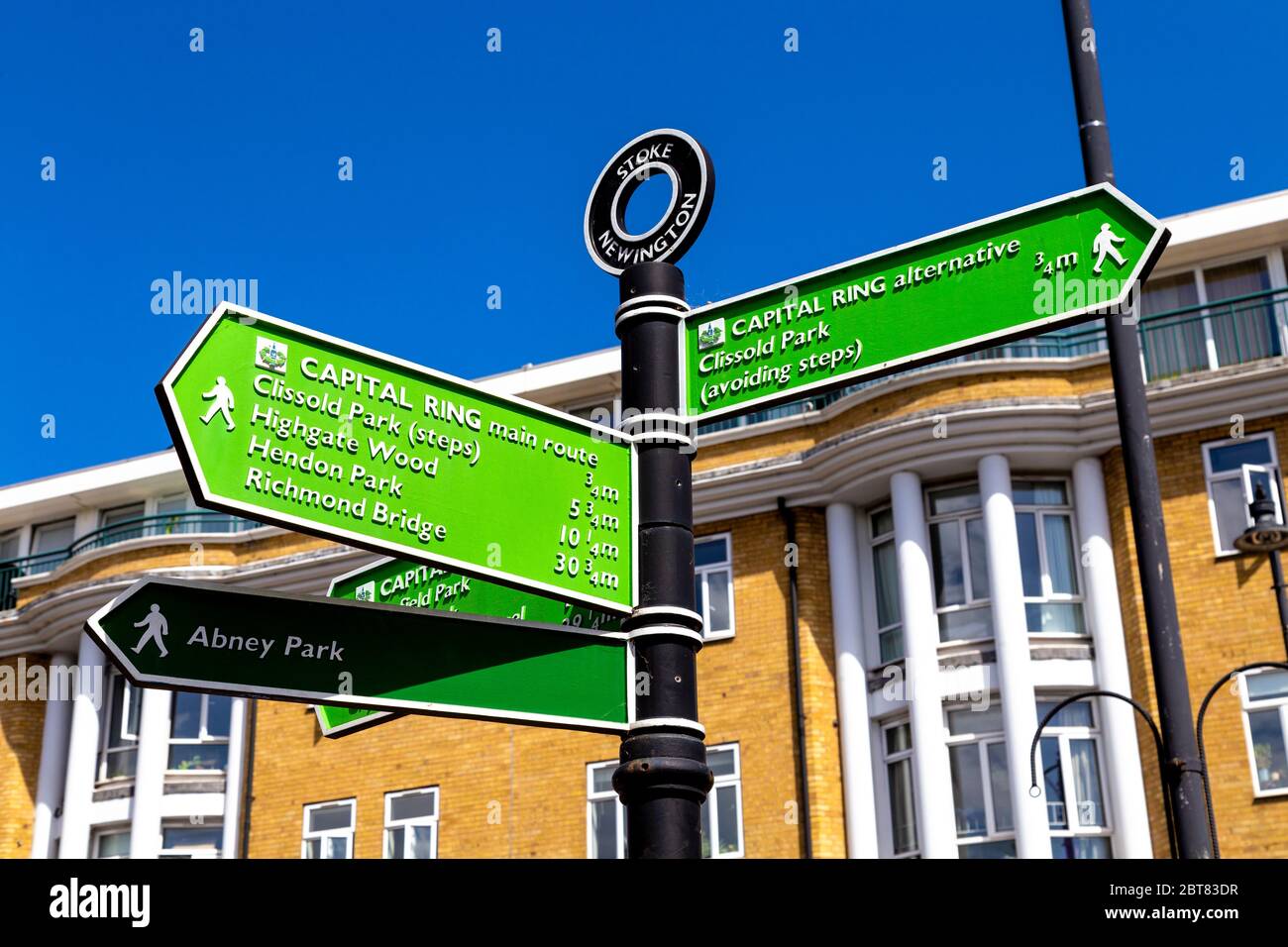 Green arrow direction sign for Capital Ring walk in Stoke Newington ...