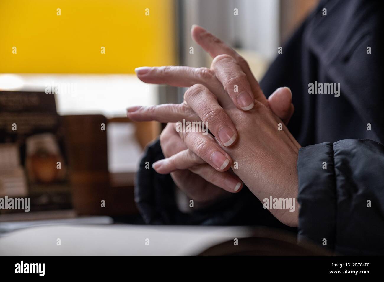 Woman's hands in thinking gesture while discussing an important issue ...