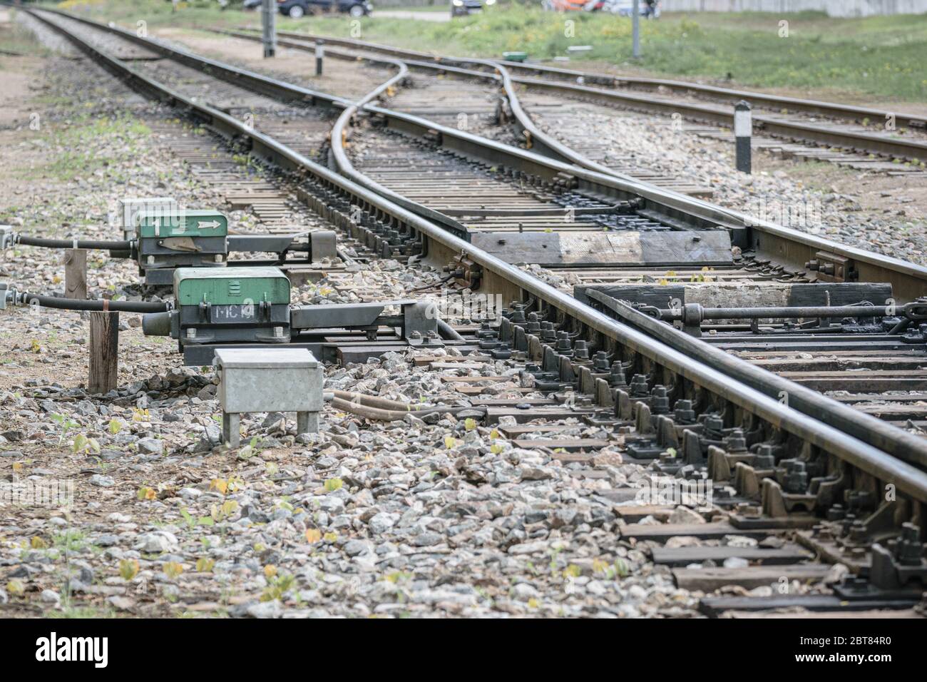 electric remote rail switch. Iron rails on concrete sleepers ...
