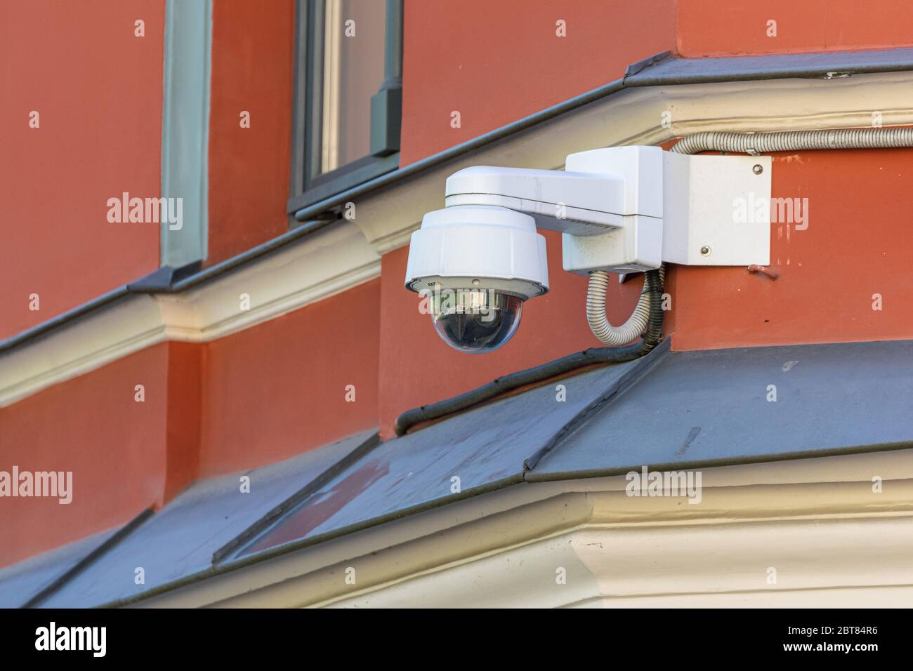 360 degrees security surveillance camera. Camcorder on a house corner ...
