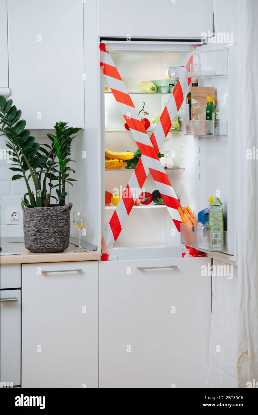No food, fridge sealed with striped tape Stock Photo - Alamy