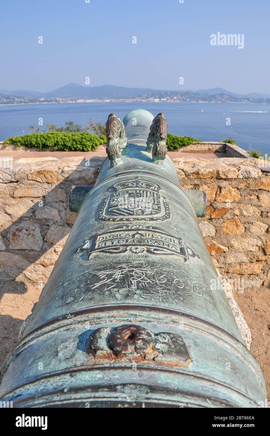 Ornate bronze cannon aimed over the wall of the St-Tropez Citadel ...