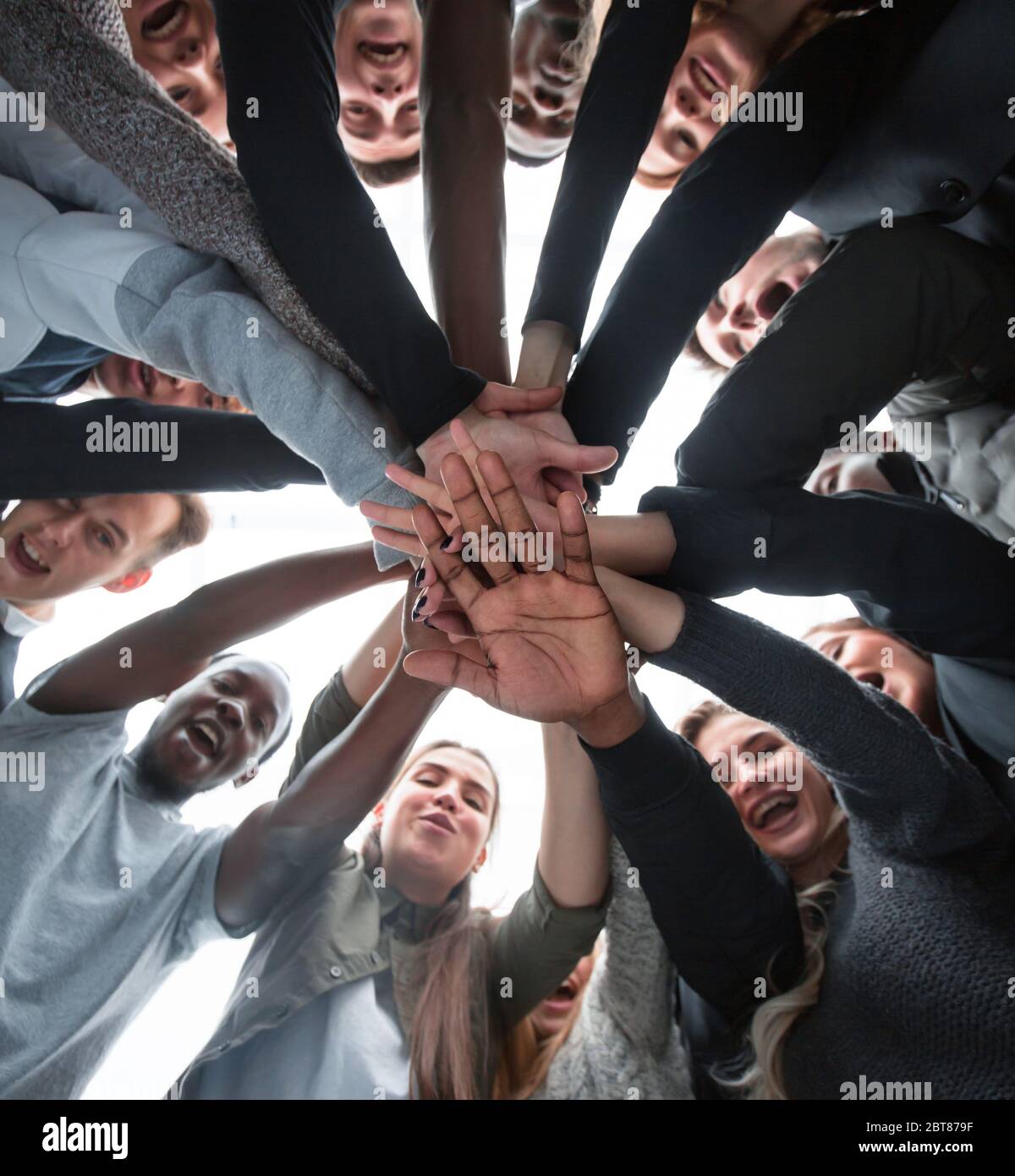 bottom view. group of happy young people making a stack of hands Stock ...