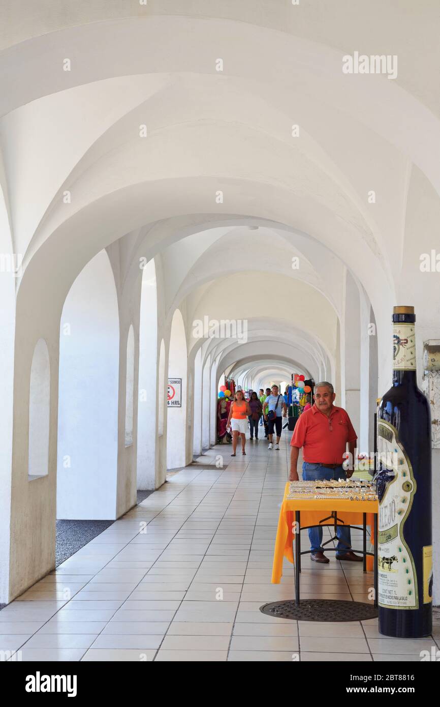 Arches & stores, Manzanillo City, Colima State, Mexico Stock Photo - Alamy