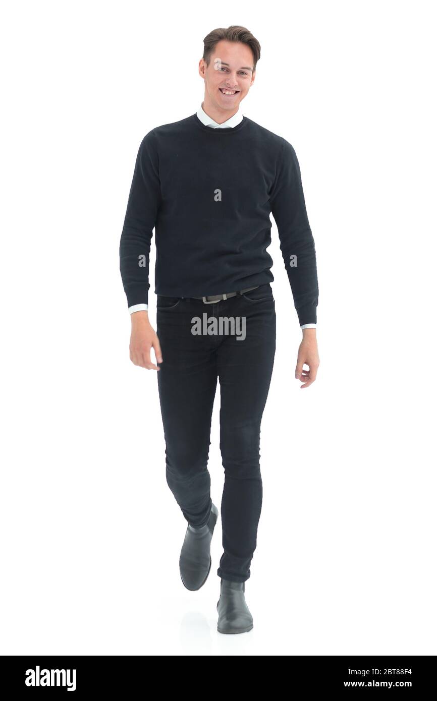 in full growth. confident th young man striding forward Stock Photo - Alamy