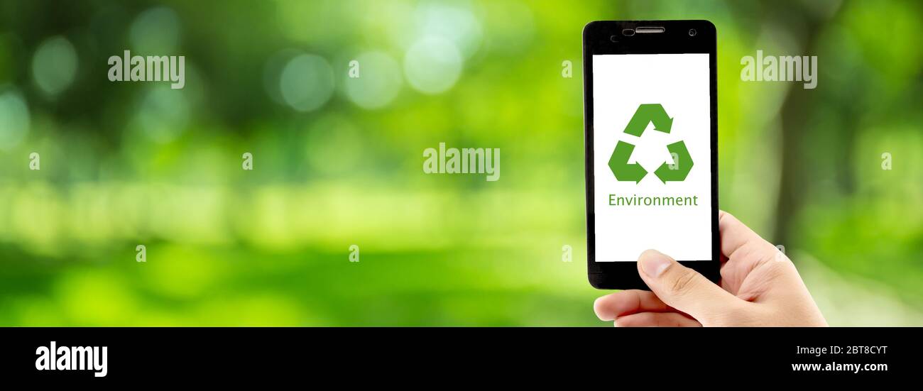 Smart phone holding hand with recycle symbol eco environment Icon ...