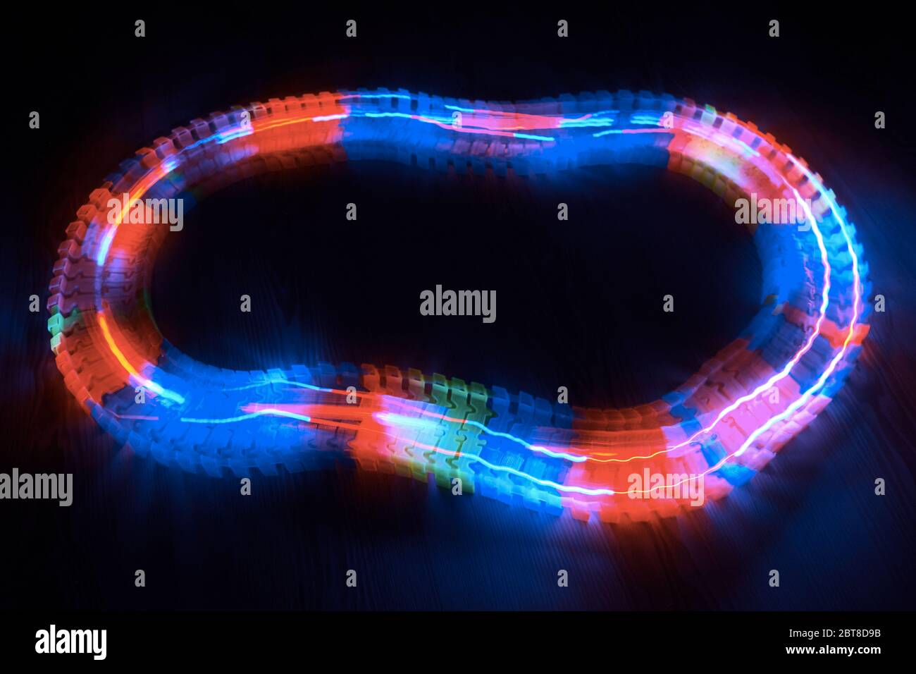 Lightrails of a radio controlled toy car headlights on a plastic toy ...