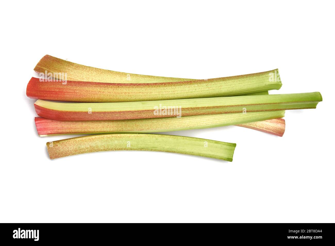 Rhubarb stalks cut and prepared isolated on white background Stock ...