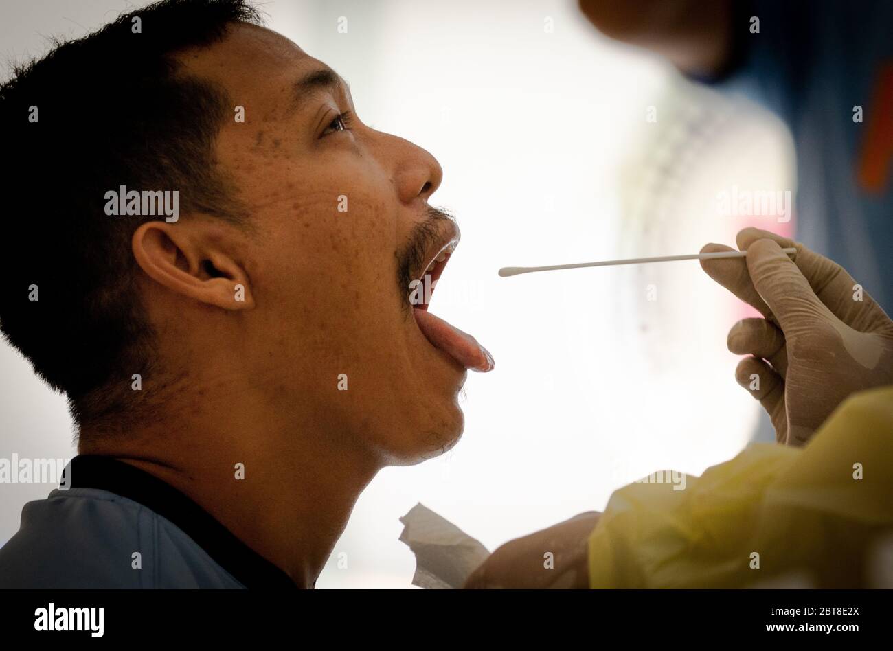Participant on swab testing training during a demonstration conducted ...