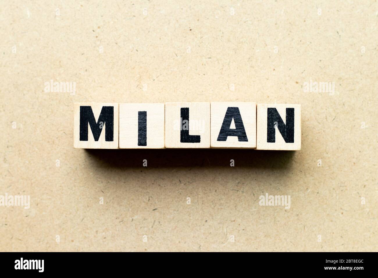 Letter block in word Milan on wood background Stock Photo - Alamy