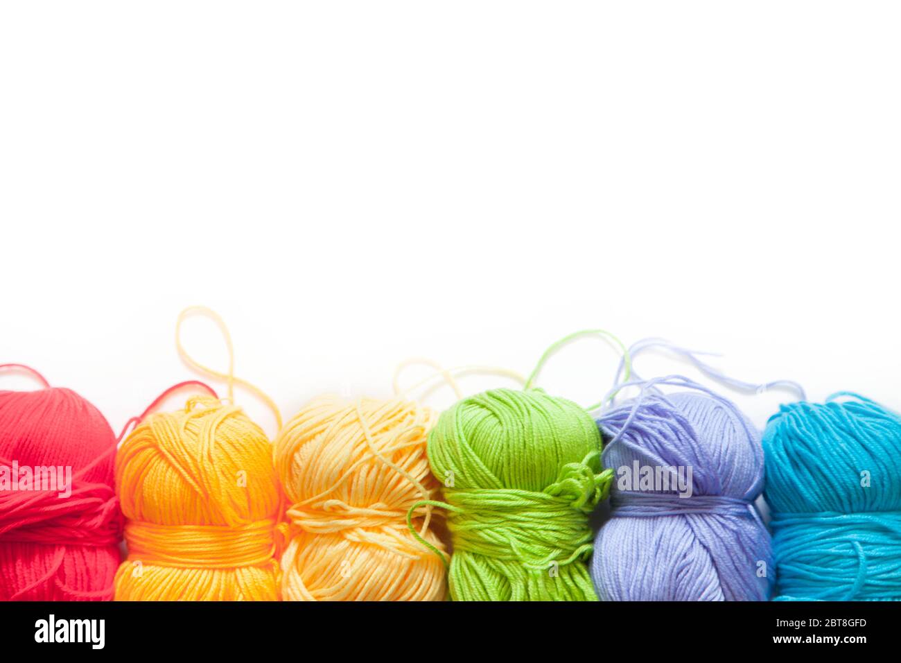 Colored balls of yarn. View from above. Rainbow colors. All colors ...