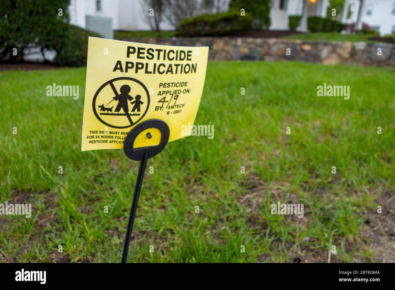 suburban home pesticide yellow tag label on lawn message with graphic ...