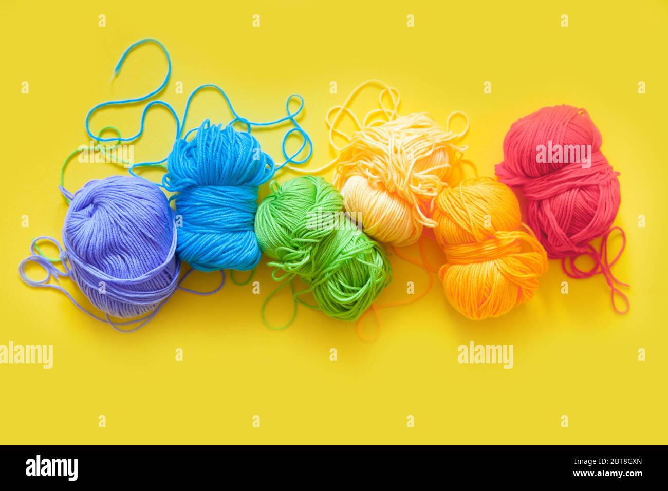 Colored balls of yarn. View from above. Rainbow colors. All colors ...