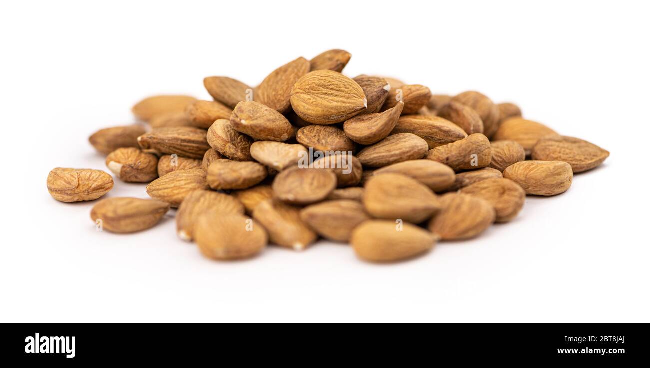 Portion of Apricot Kernels isolated on white background as detailed ...