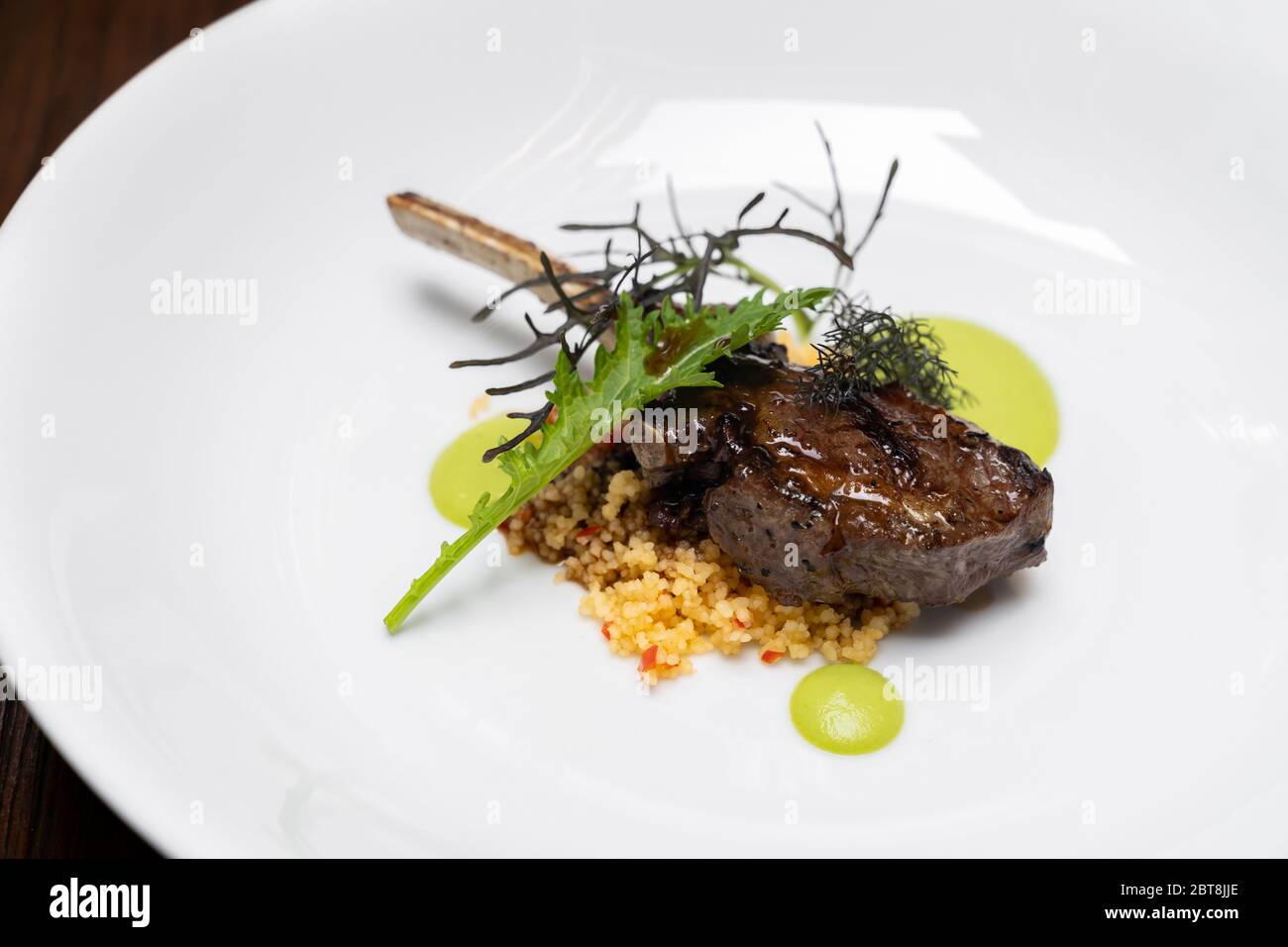 Grilled lamb chop with pesto sauce, international gourmet cuisine a la ...