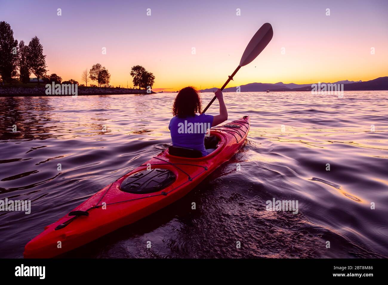 Girl Kayaking in a Modern City Stock Photo - Alamy