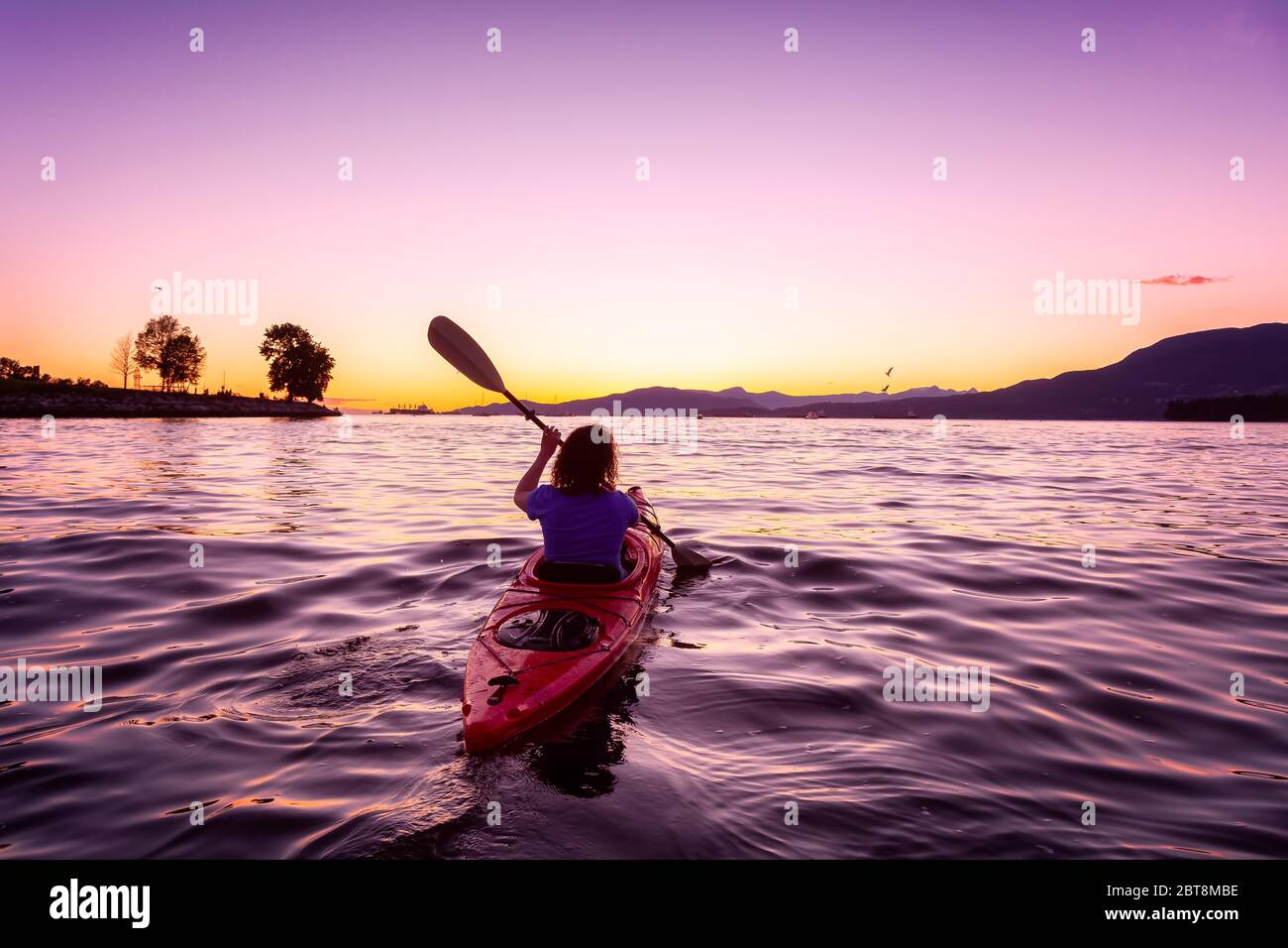 Girl Kayaking in a Modern City Stock Photo - Alamy