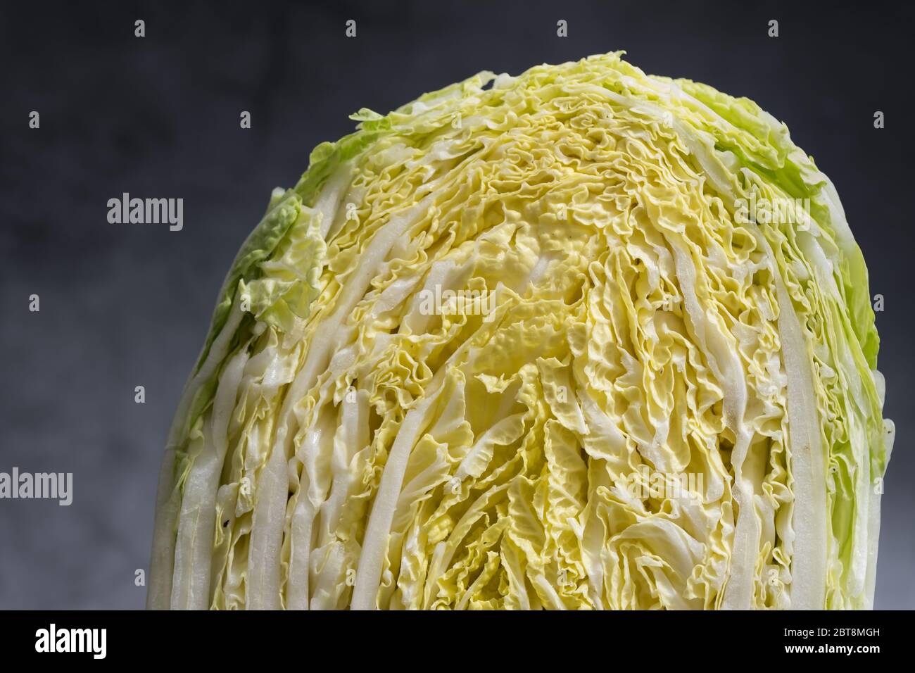 freshly half cut cabbage on black background Stock Photo - Alamy