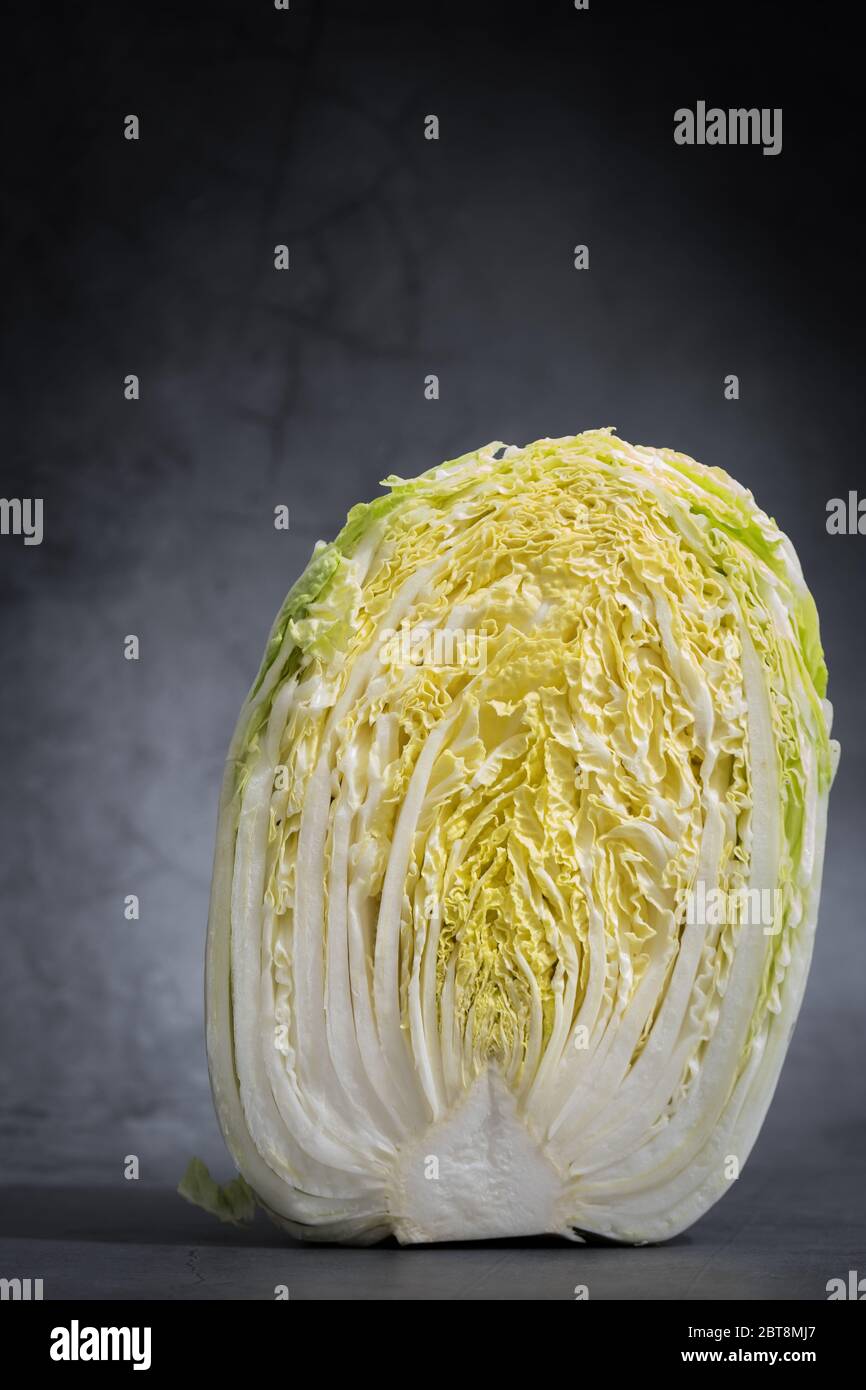 freshly half cut cabbage on black background Stock Photo - Alamy