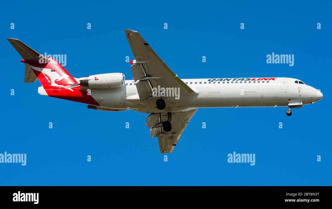Fokker F100 VH-NQE of QantasLink on approach to Perth Airport, Western ...
