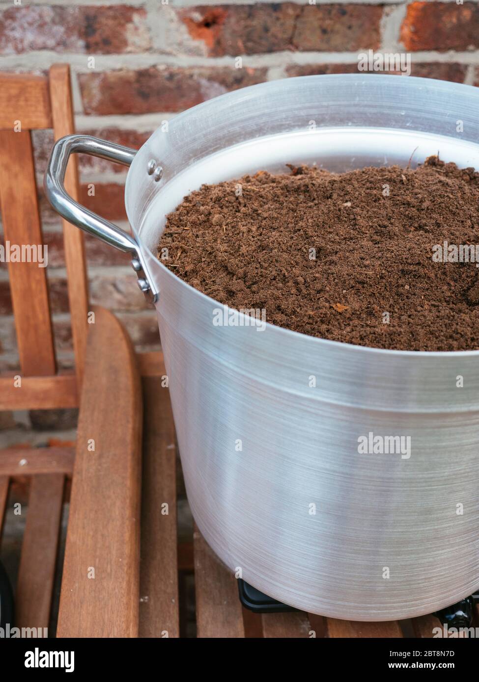 Soil steamer pot filled with soil Stock Photo - Alamy