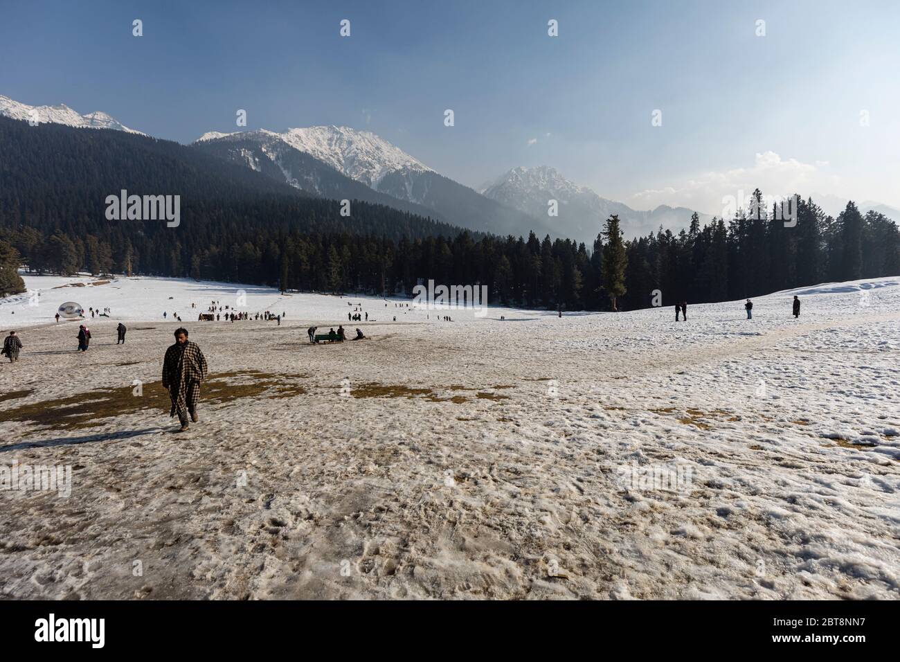 View of tourists enjoying the snow at the popular hill station Pahalgam ...