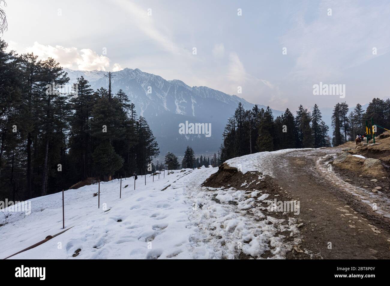 View of a road through the snowy Himalayan mounts in the hill station ...