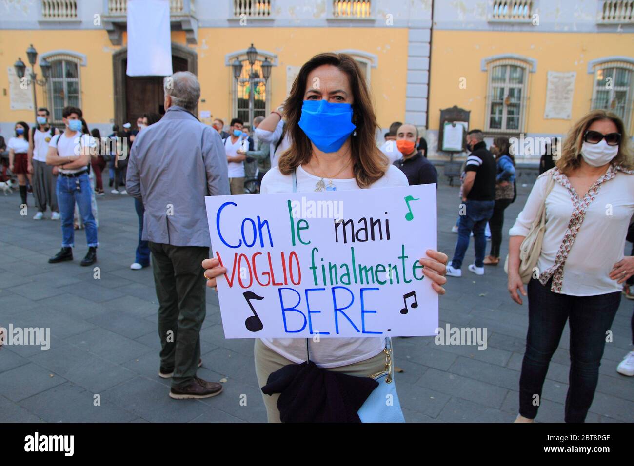 A woman with a mask and her cartel participates in the flash mob ...