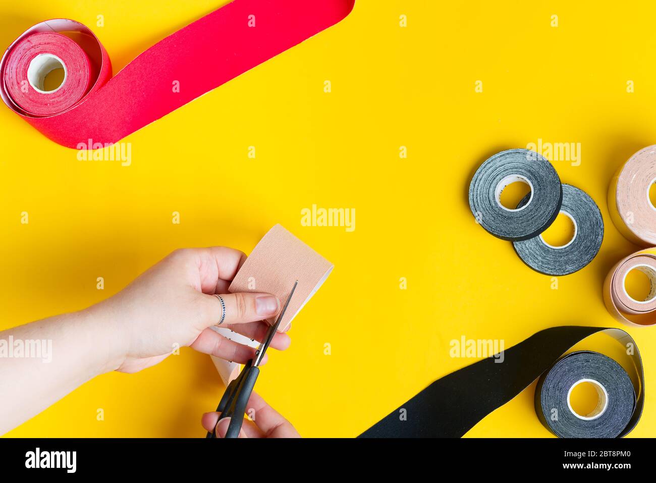 Step by step process of cutting red tape by woman's hands for ...