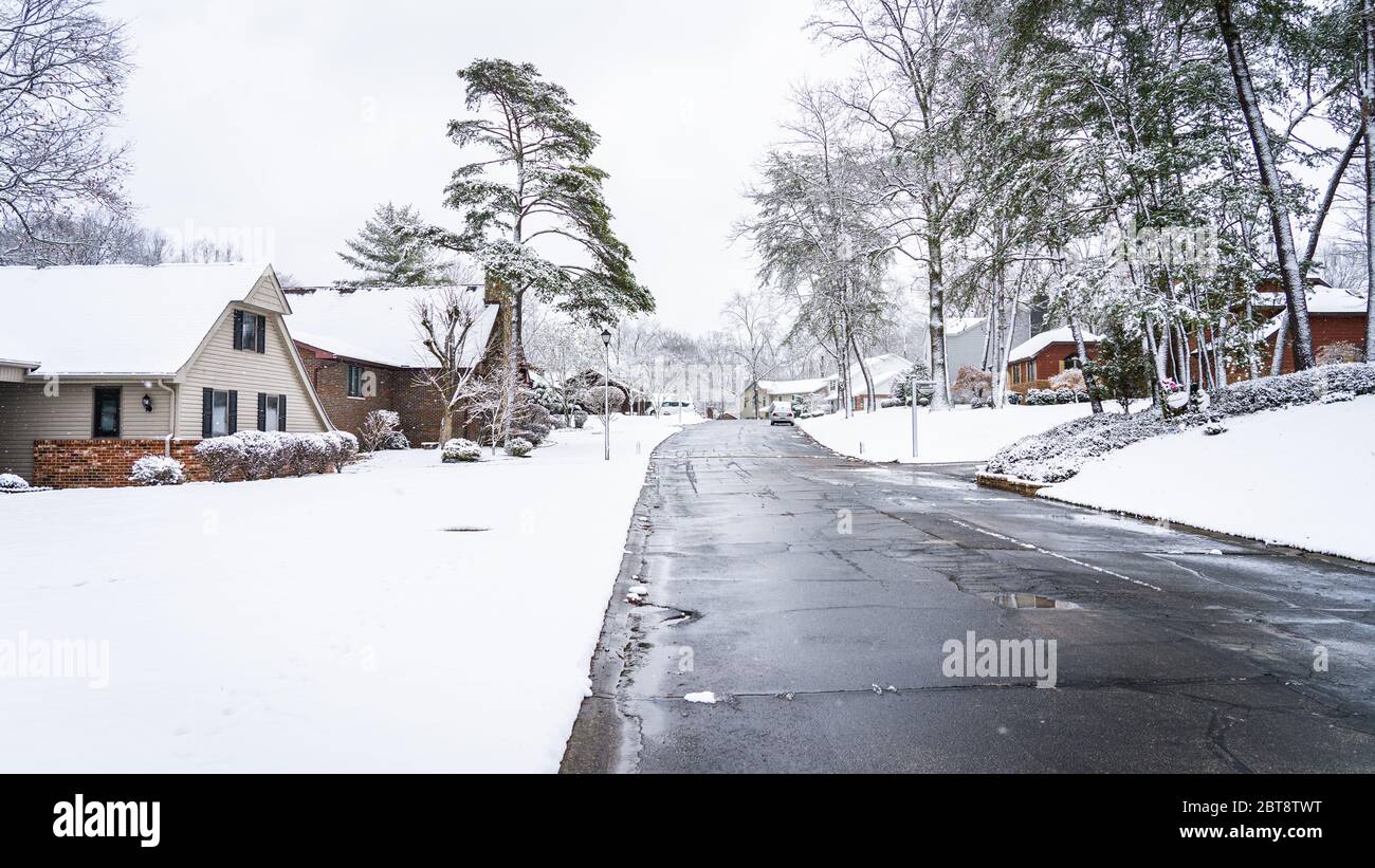 A landscape of a residential community seen covered with snow during a ...