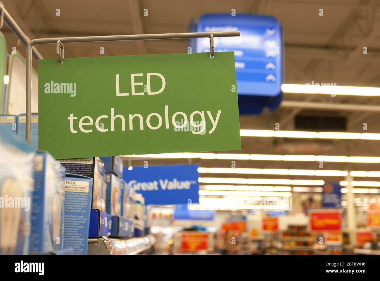 Motion of led technology sign on new smart bulb section inside Walmart ...